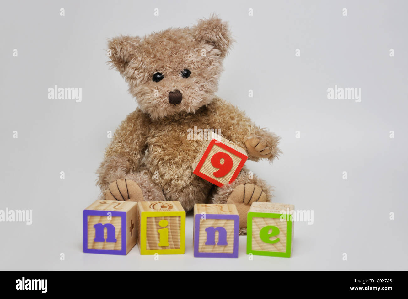 Teddy bear with cubes Stock Photo - Alamy