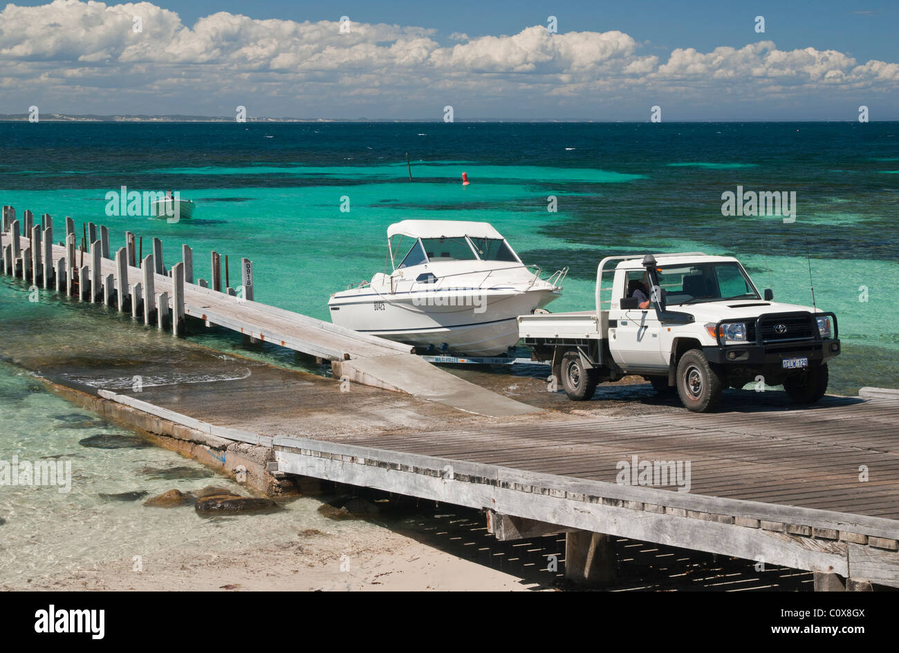 A ute tows a boat up a boat ramp in the town of Augusta, Western ...