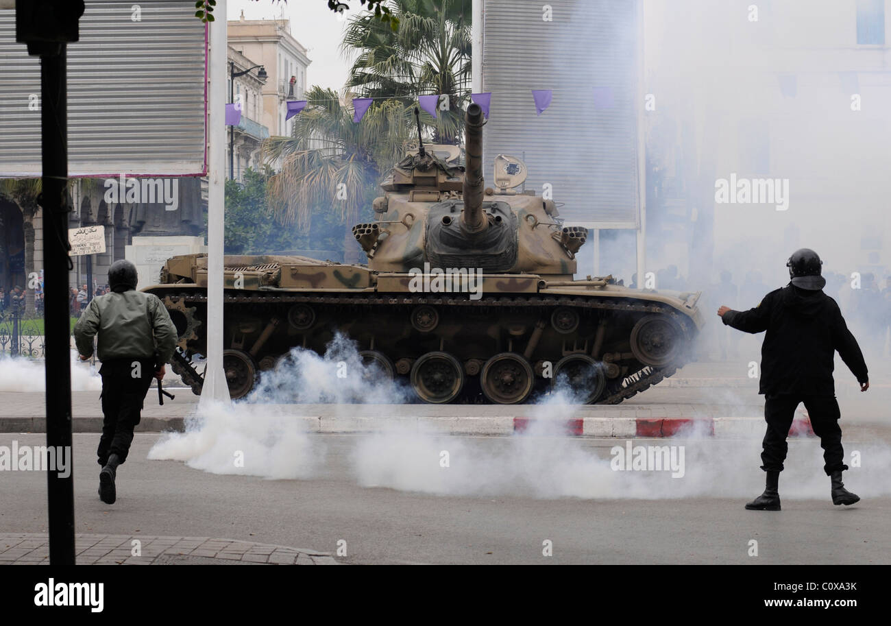 An army tank engulfed by tear gas during a protest during the Jasmine ...