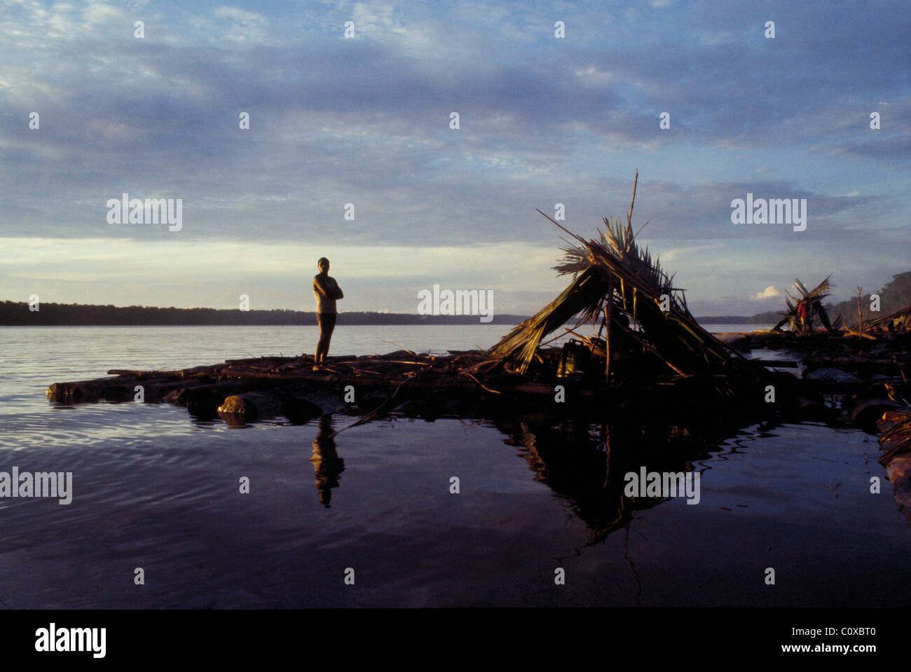 Asmat and boats on the Syrets river. West Papua Stock Photo - Alamy