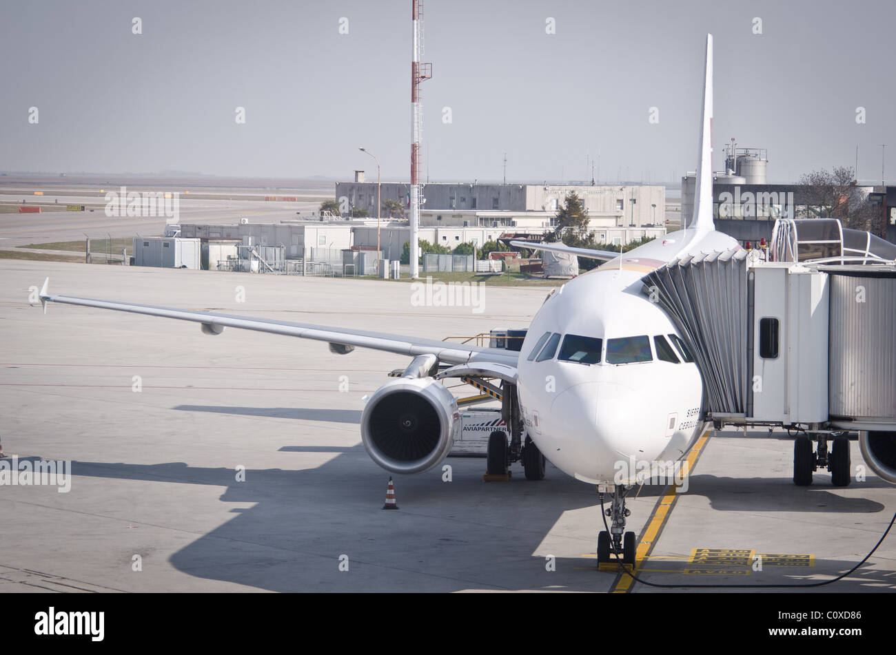 Plane and passenger gangway at Airport Stock Photo - Alamy