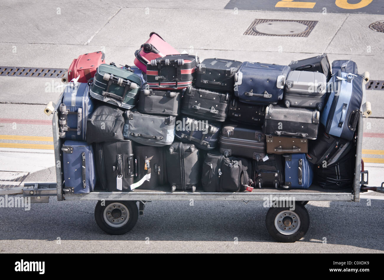Luggage being transported at airport Stock Photo - Alamy
