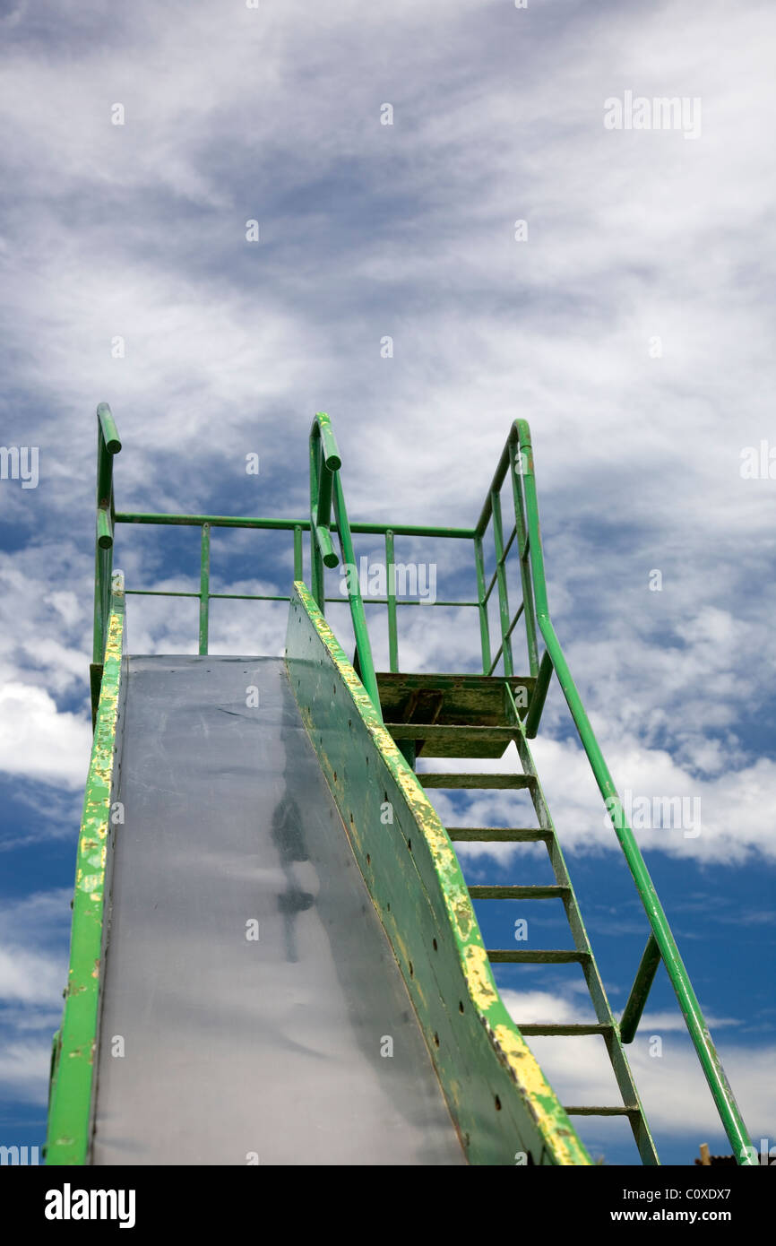 Green slide in park Stock Photo - Alamy