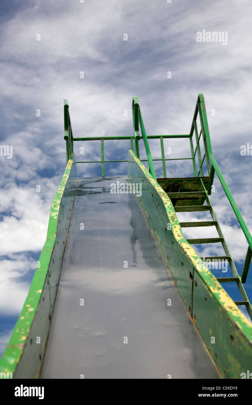 Green slide in park Stock Photo - Alamy