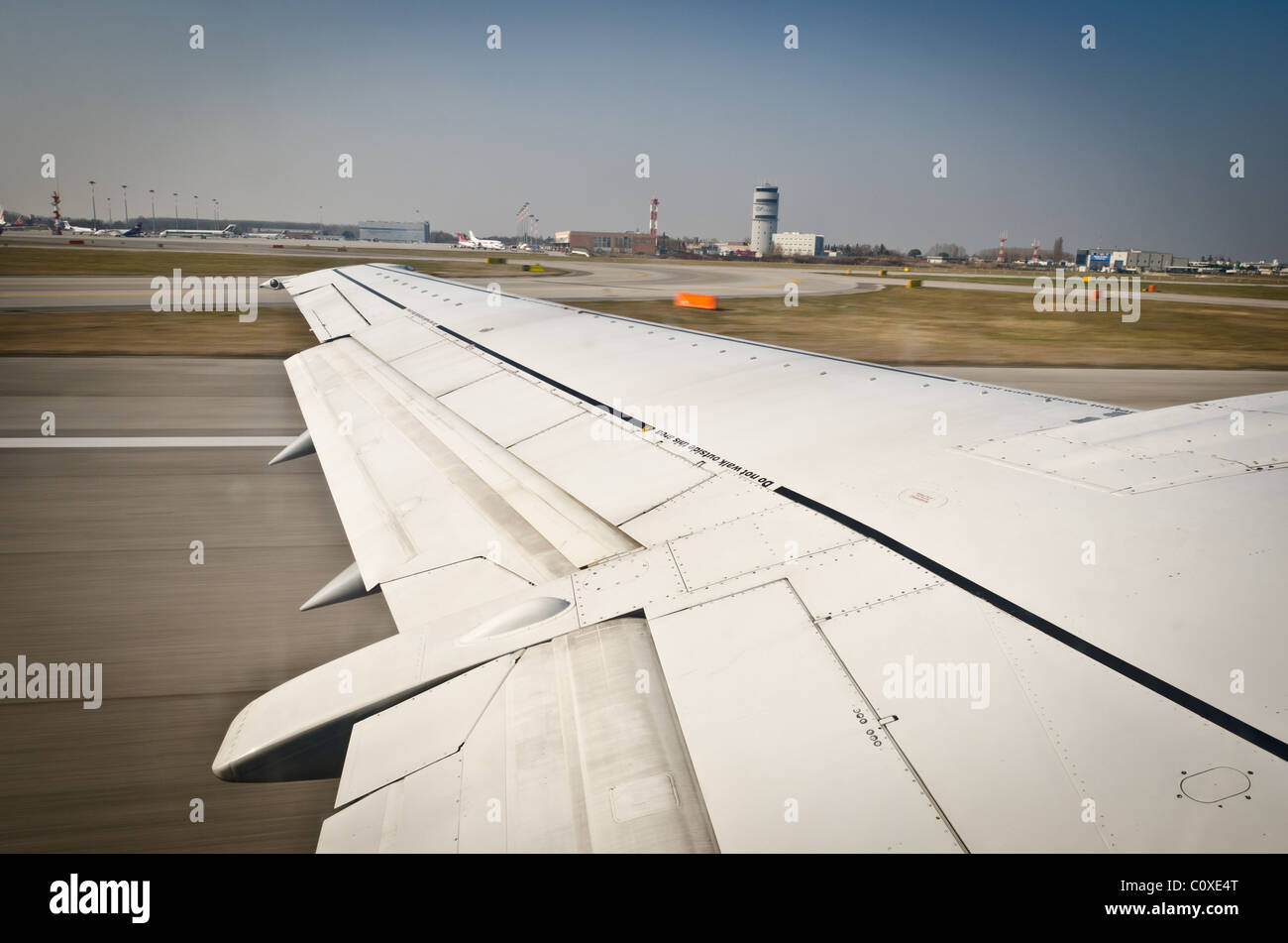 wing of plane landing at airport Stock Photo - Alamy