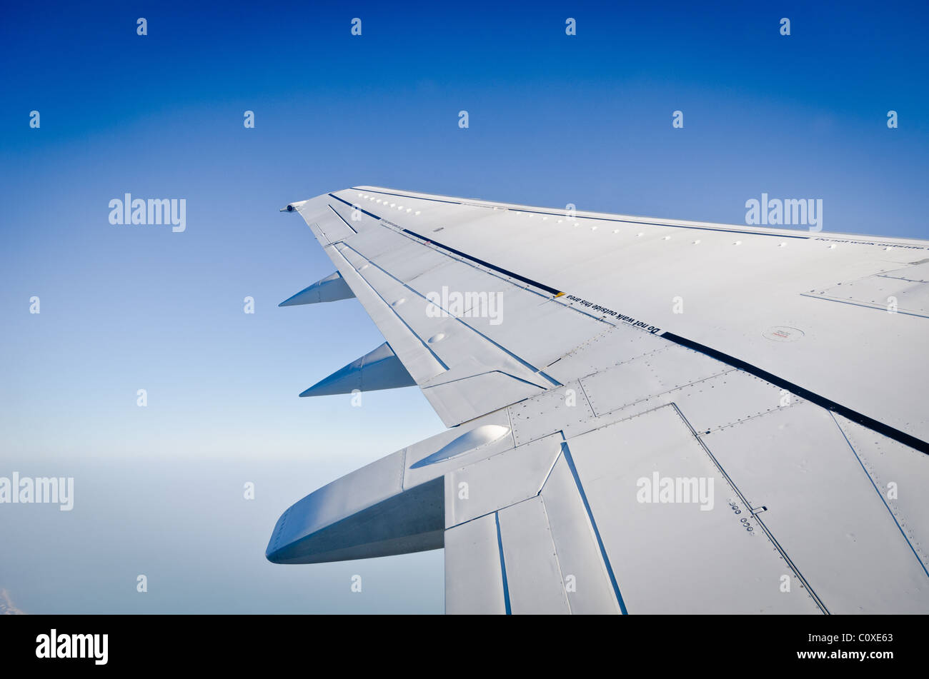 wing of plane infilght Stock Photo - Alamy