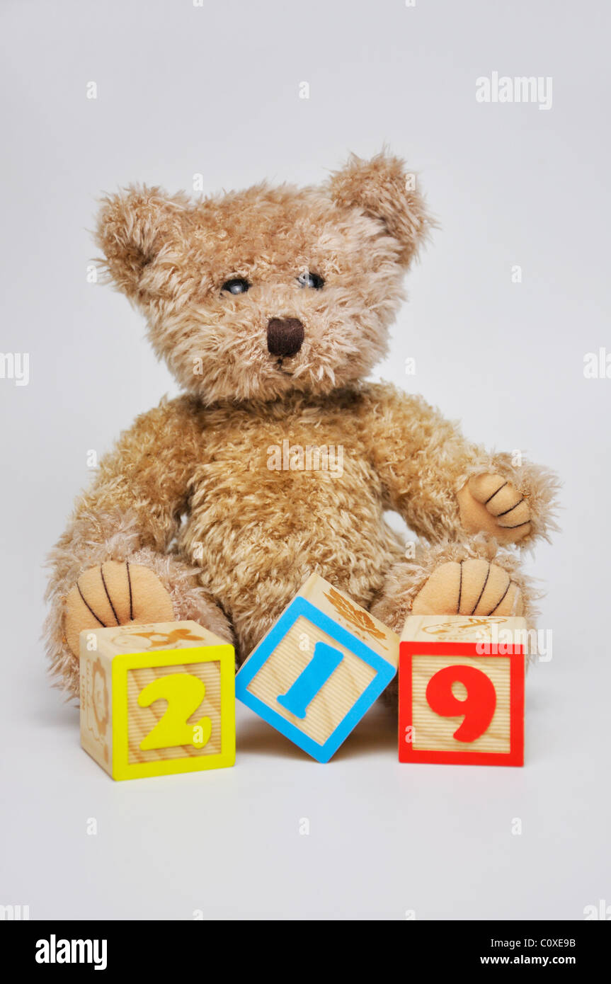 Teddy bear with cubes Stock Photo - Alamy
