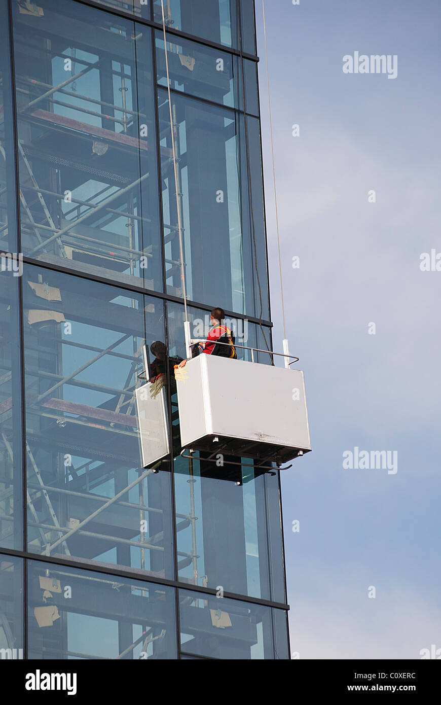 A Window washer work high above the city streets Stock Photo - Alamy
