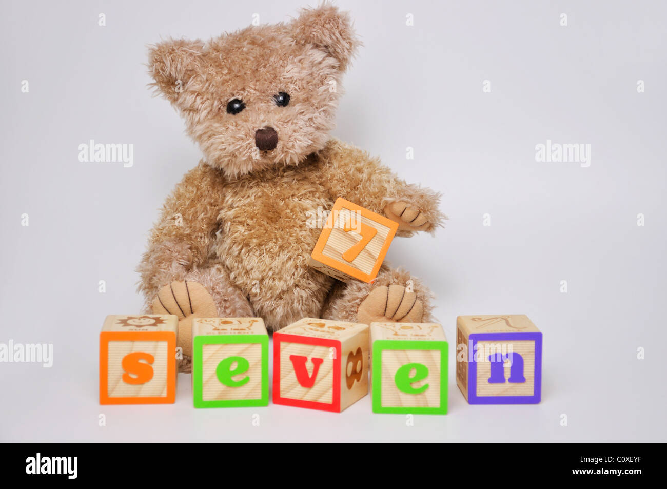 Teddy bear with cubes Stock Photo - Alamy
