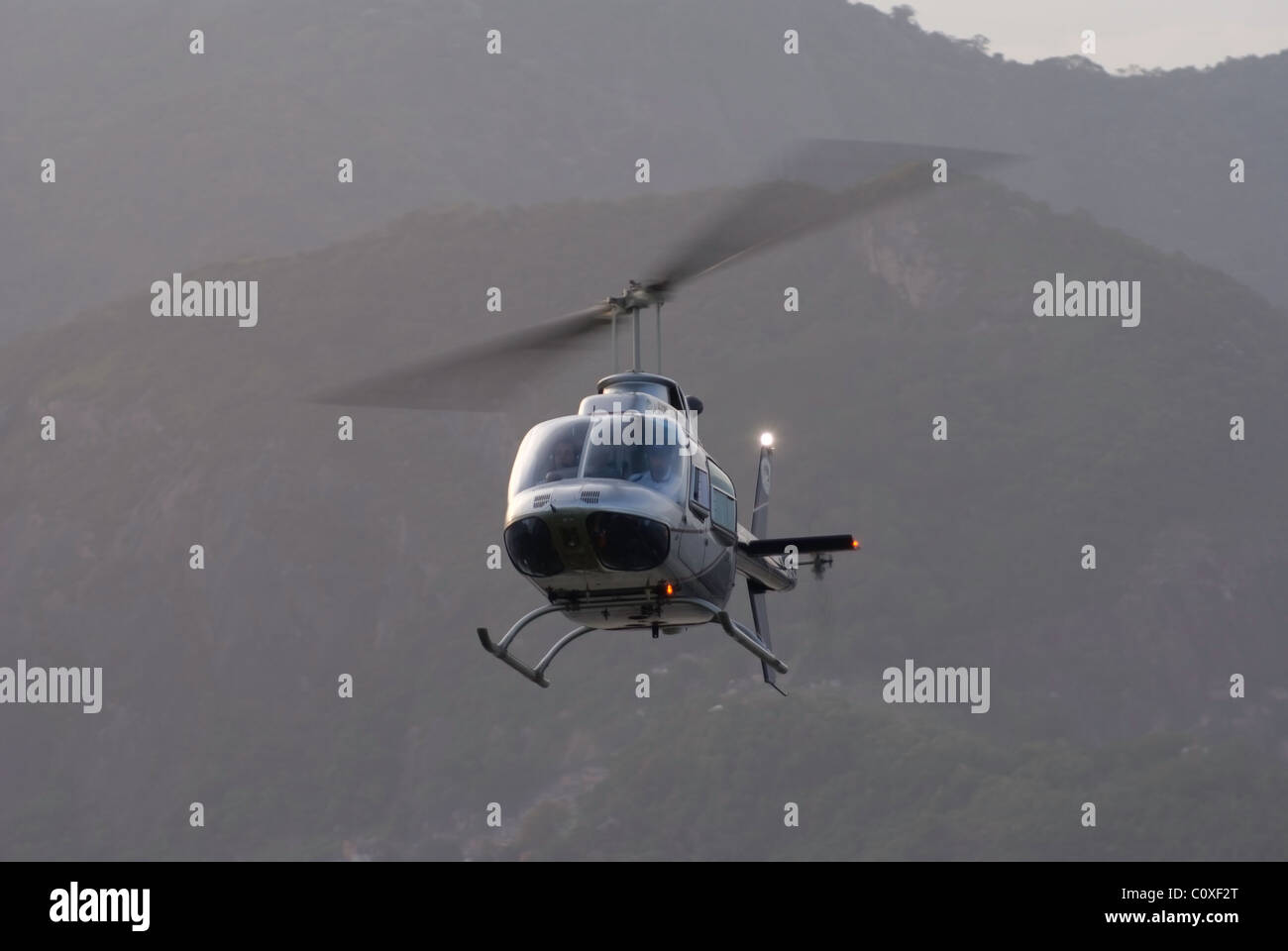 Helicopter in flight Stock Photo - Alamy