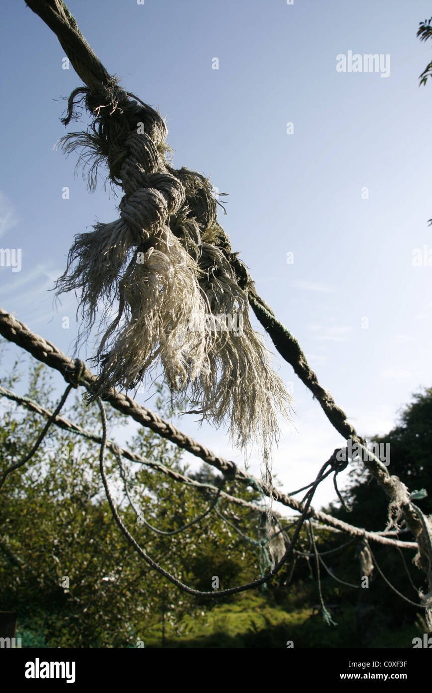 old rope bridge in field in countryside Stock Photo - Alamy
