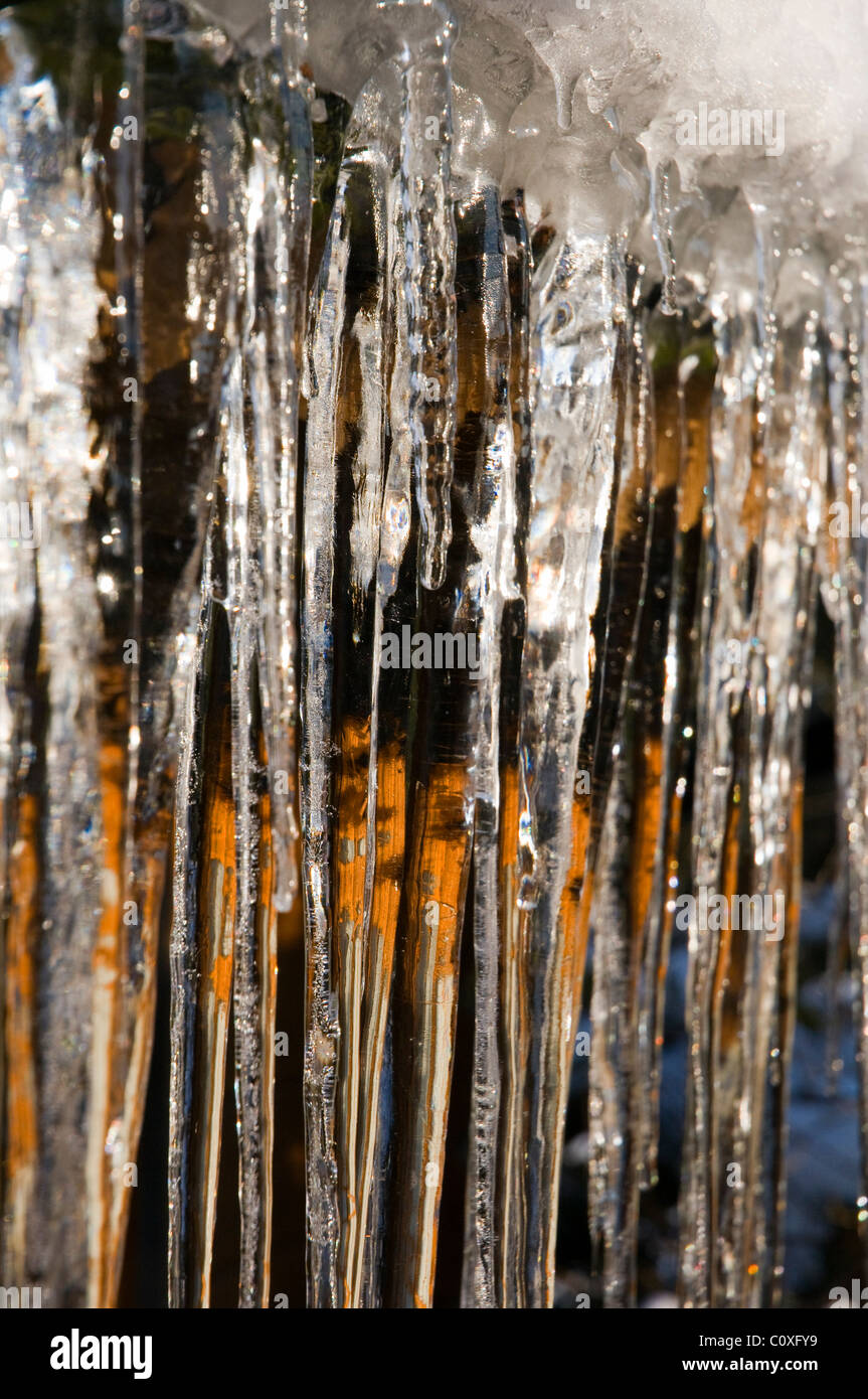Melting dripping icicles from roof hi-res stock photography and images ...