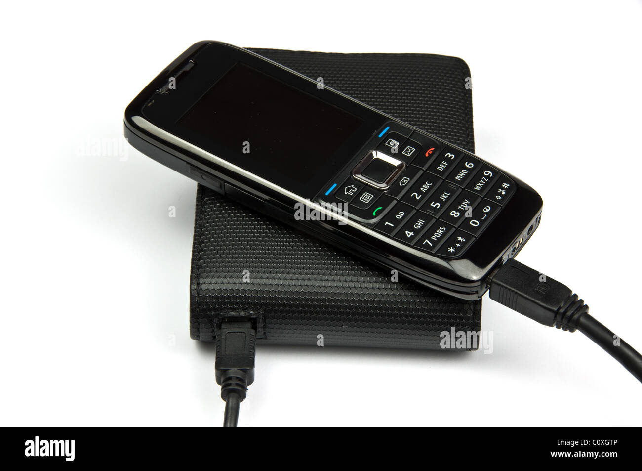 photo of mobile phone connected to external hard drive Stock Photo - Alamy