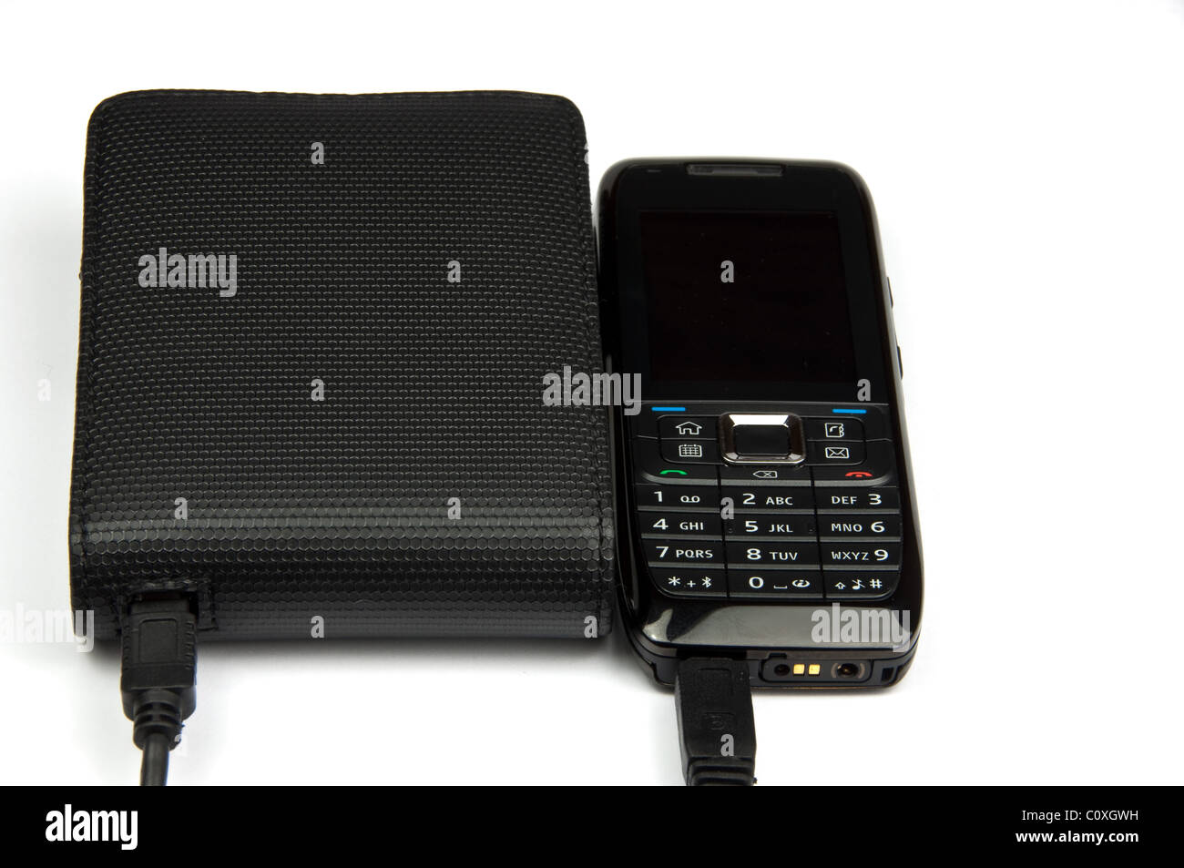 photo of mobile phone connected to external hard drive Stock Photo - Alamy