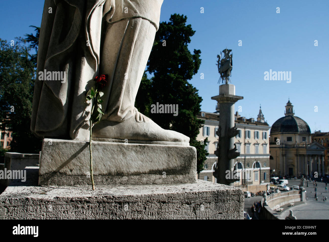 statue with red rose in piazza del popolo square in rome Stock Photo ...