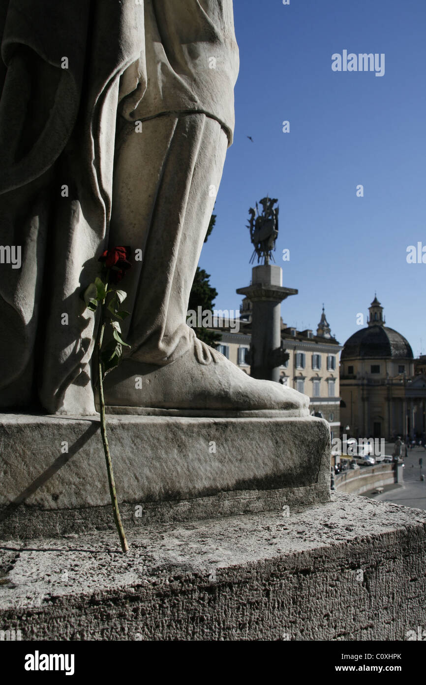statue with red rose in piazza del popolo square in rome Stock Photo ...