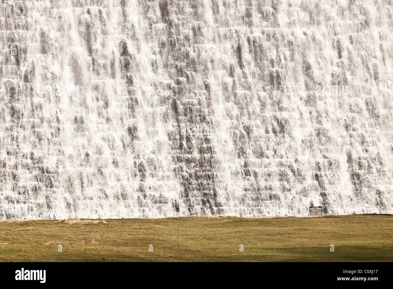 Water flowing down Howden Dam at Upper Derwent Valley Reservoir in the ...