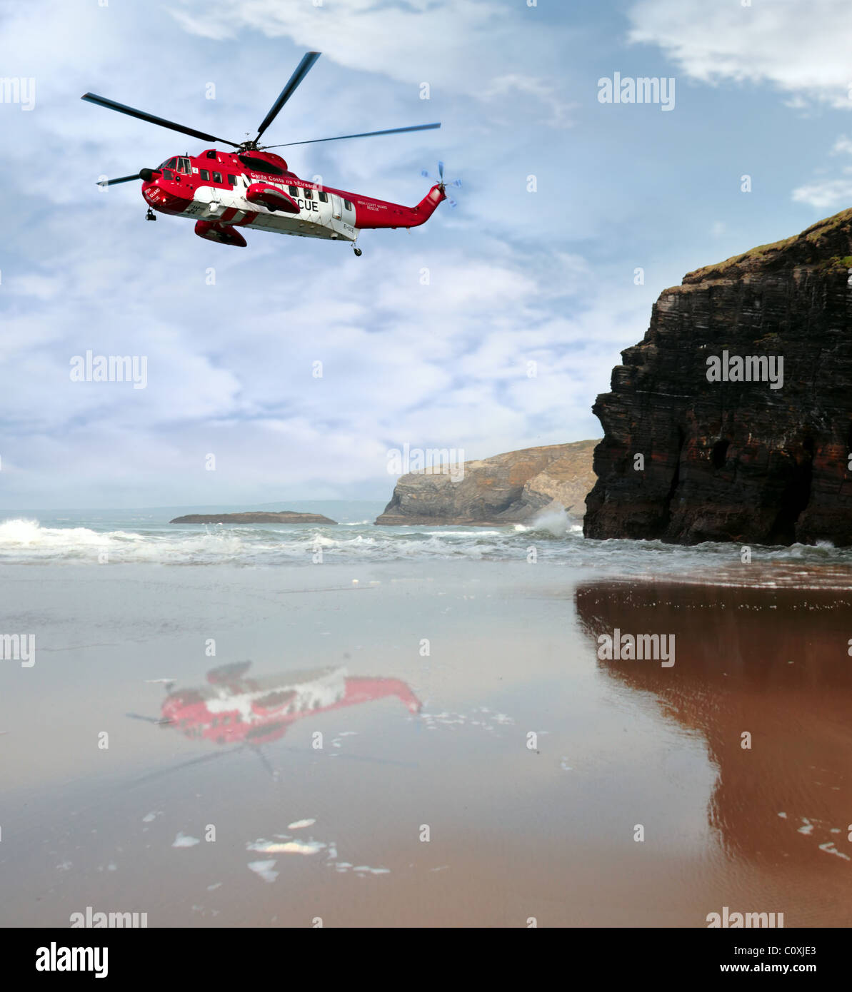 a sea rescue helicopter searching for person near to the cliffs on ...