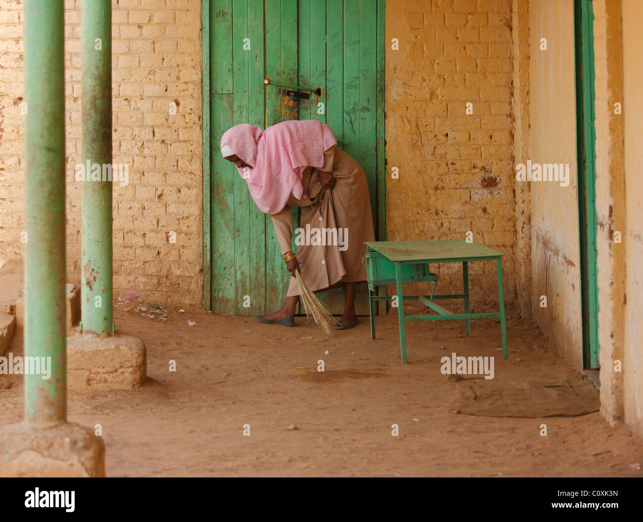 African Woman Sweeping Stock Photos & African Woman Sweeping Stock ...