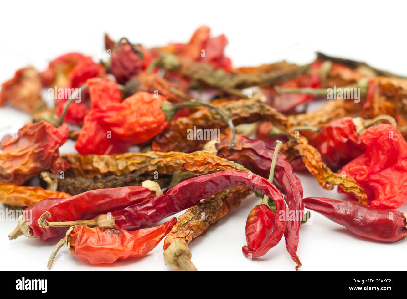 Dry red chili pepper on white background Stock Photo - Alamy