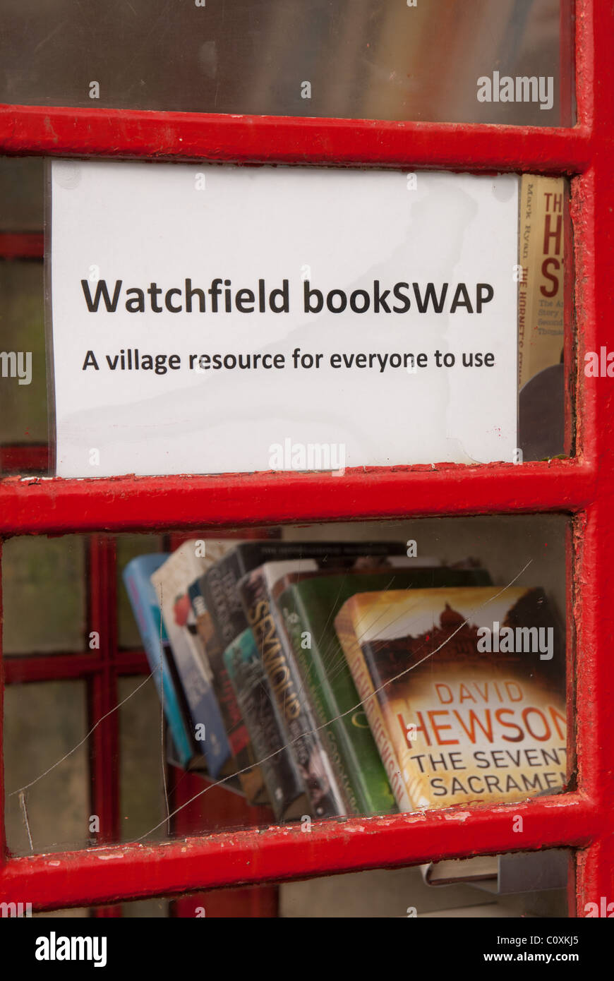 A UK village's redundant BT red telephone box now adopted by the parish ...