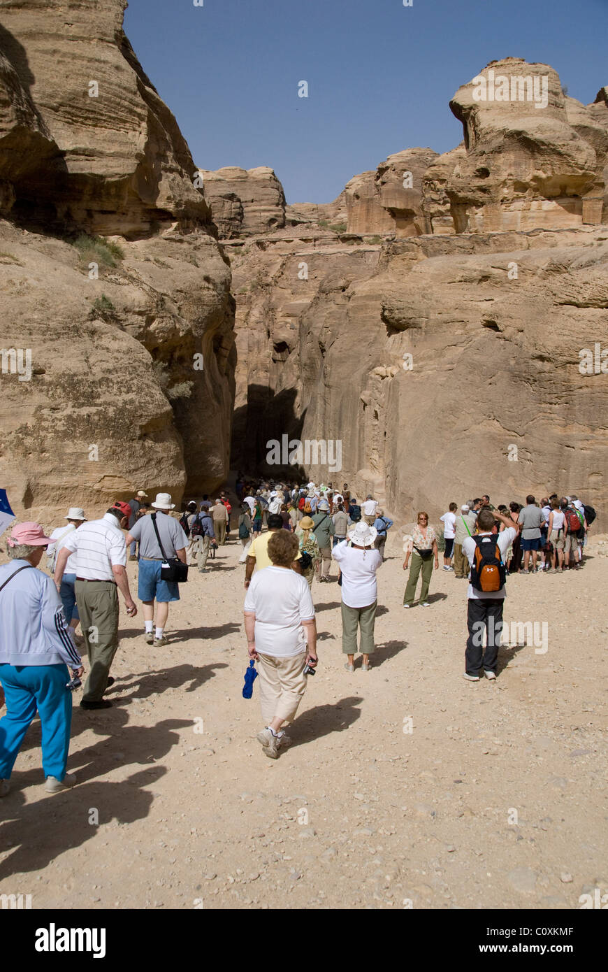 Jordan, Ancient Nabataean city of Petra. Crowds of tourists entering ...