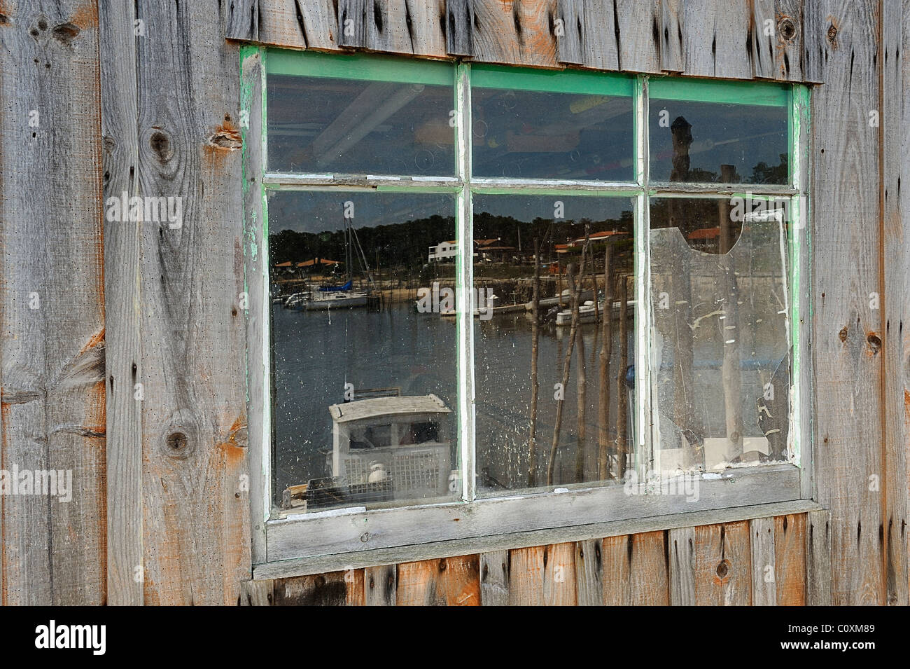 Wooden window frame of an oyster hut in the Piraillan Village, Cap ...