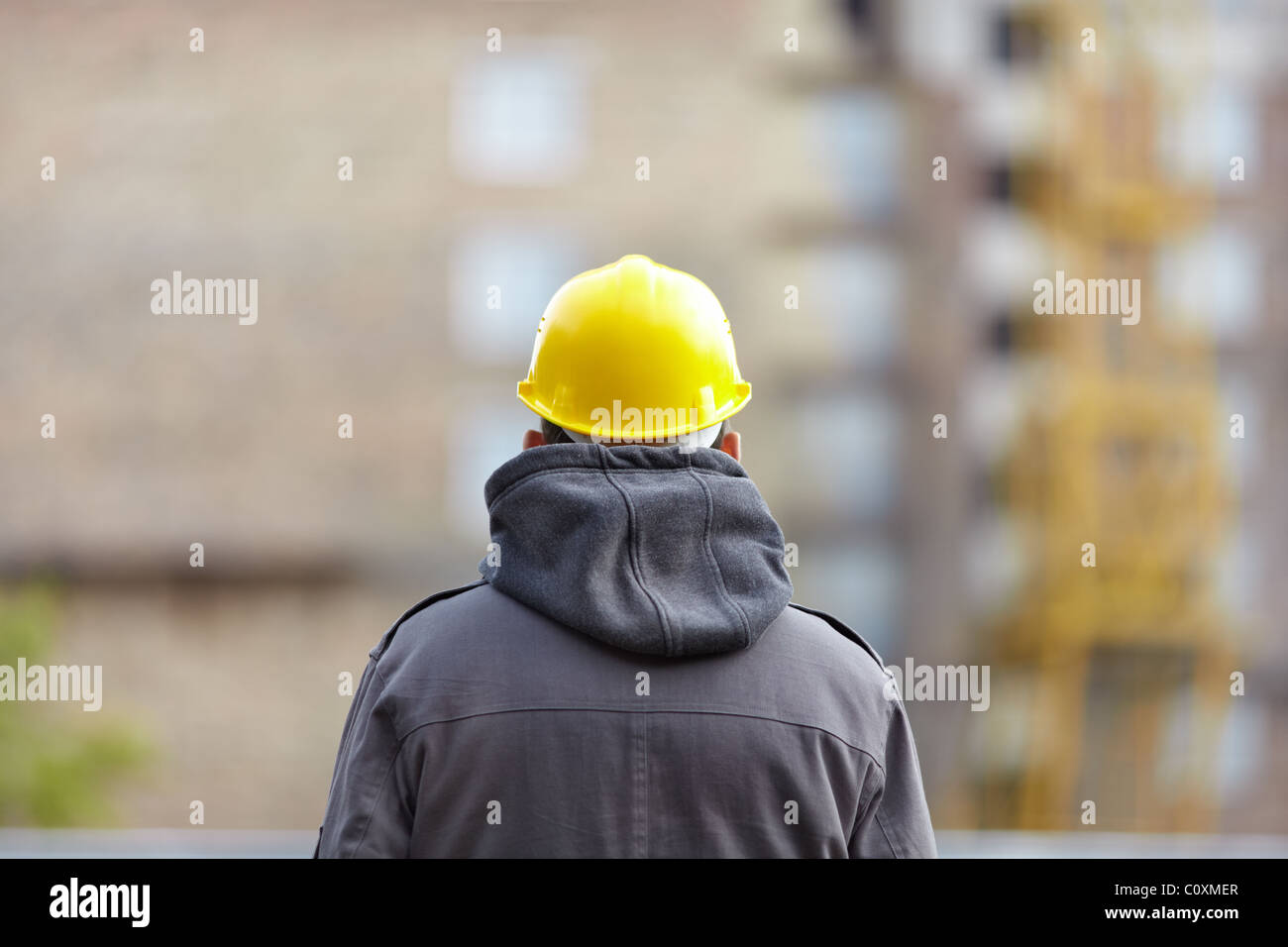 real builder with yellow hardhat Stock Photo - Alamy