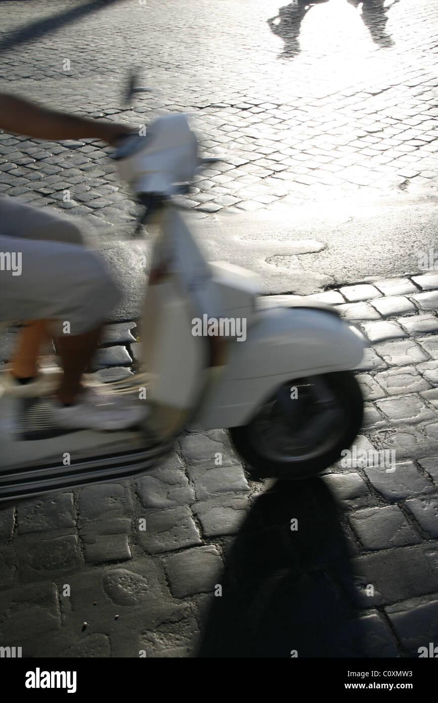 person riding scooter moped in rome italy Stock Photo - Alamy