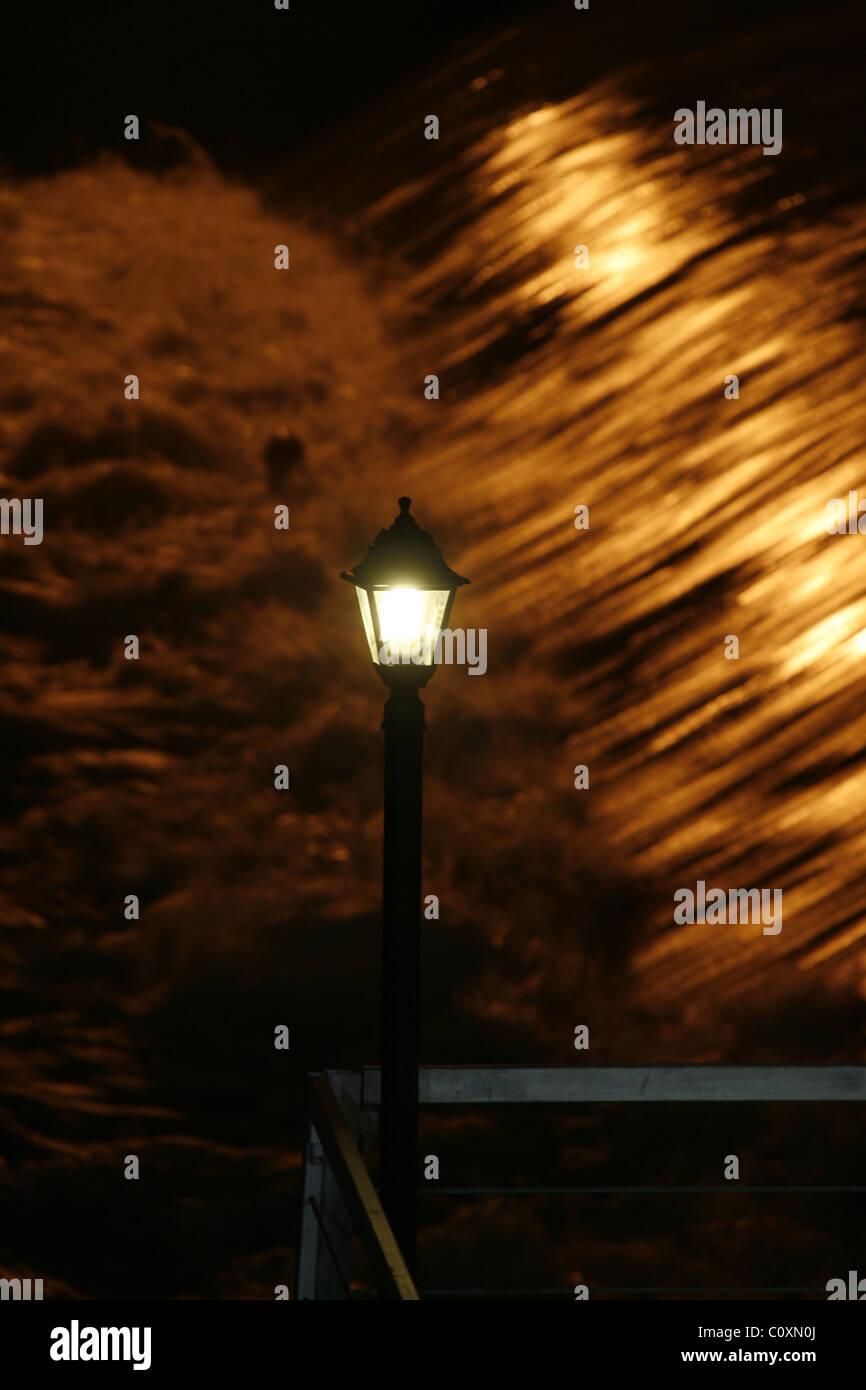 one bright light by river waterfall at night Stock Photo - Alamy