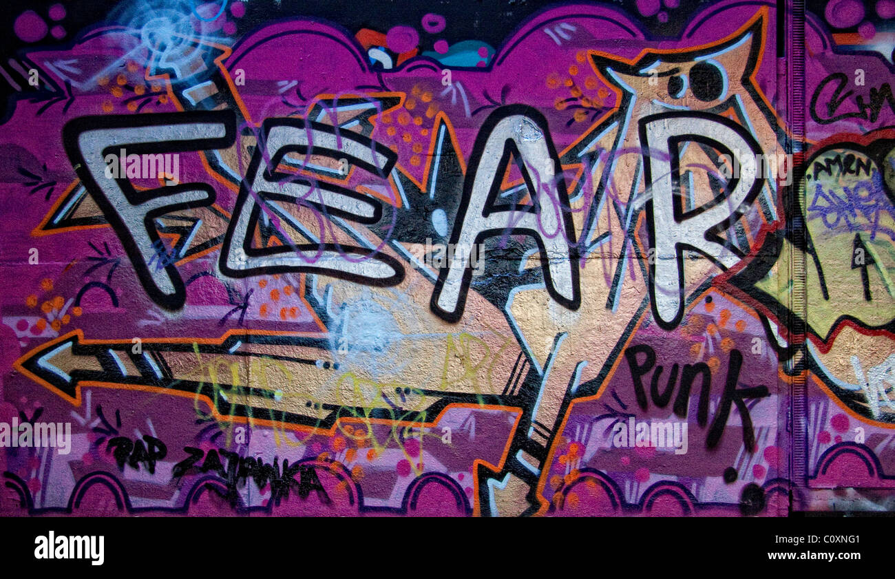 Graffiti on a wall showing the word FEAR Stock Photo - Alamy