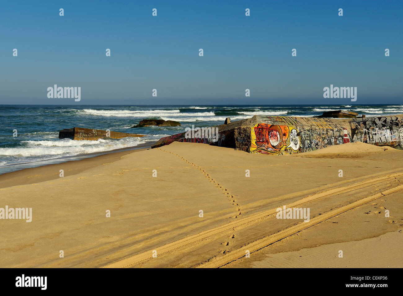 Ruined blockhaus, bunker, blockhouse, on a sandy beach of Atlantic ...