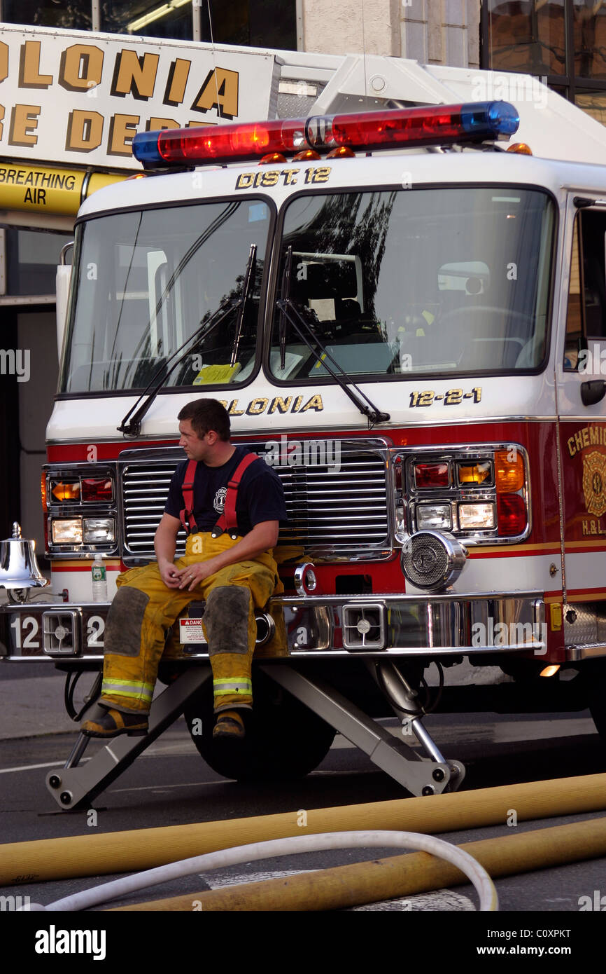 Colonia Firefighter takes a break and drinks a bottle of water to ...