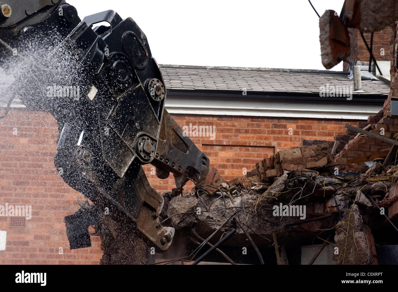 rubble from a building torn down by a demolition grab machine Stock ...