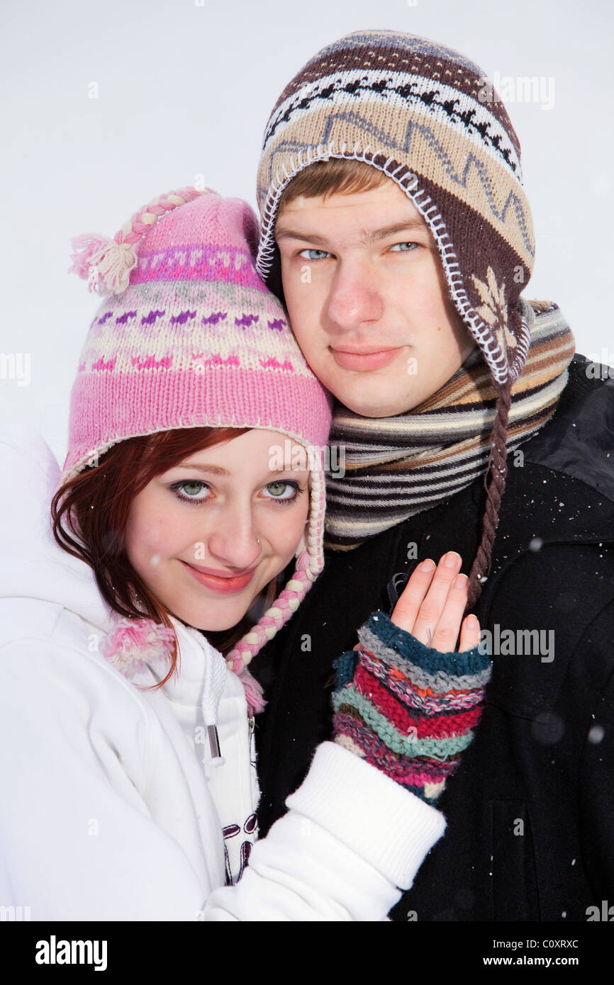 A teenage couple outside in the snow on a winter day Stock Photo - Alamy