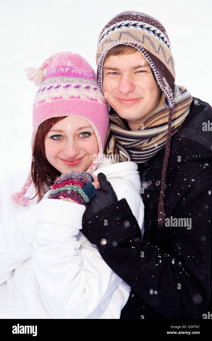 A teenage couple outside in the snow on a winter day Stock Photo - Alamy