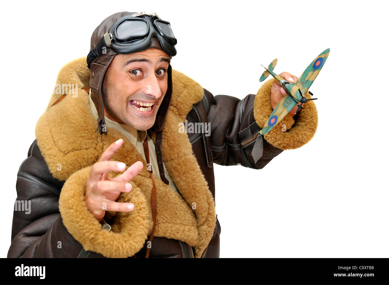 Fighter pilot with model plane isolated in white Stock Photo - Alamy