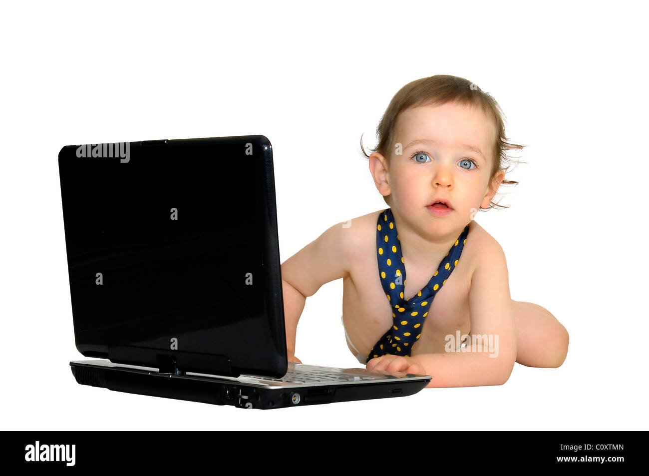 Beautiful baby executive with a tie and a laptop isolated in white ...