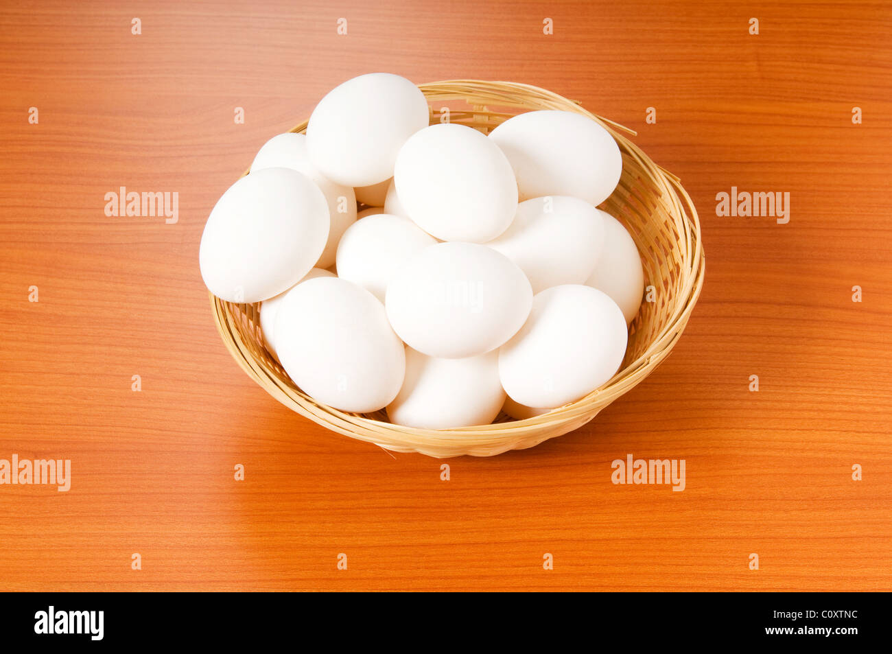 Many white eggs on the wooden table Stock Photo - Alamy