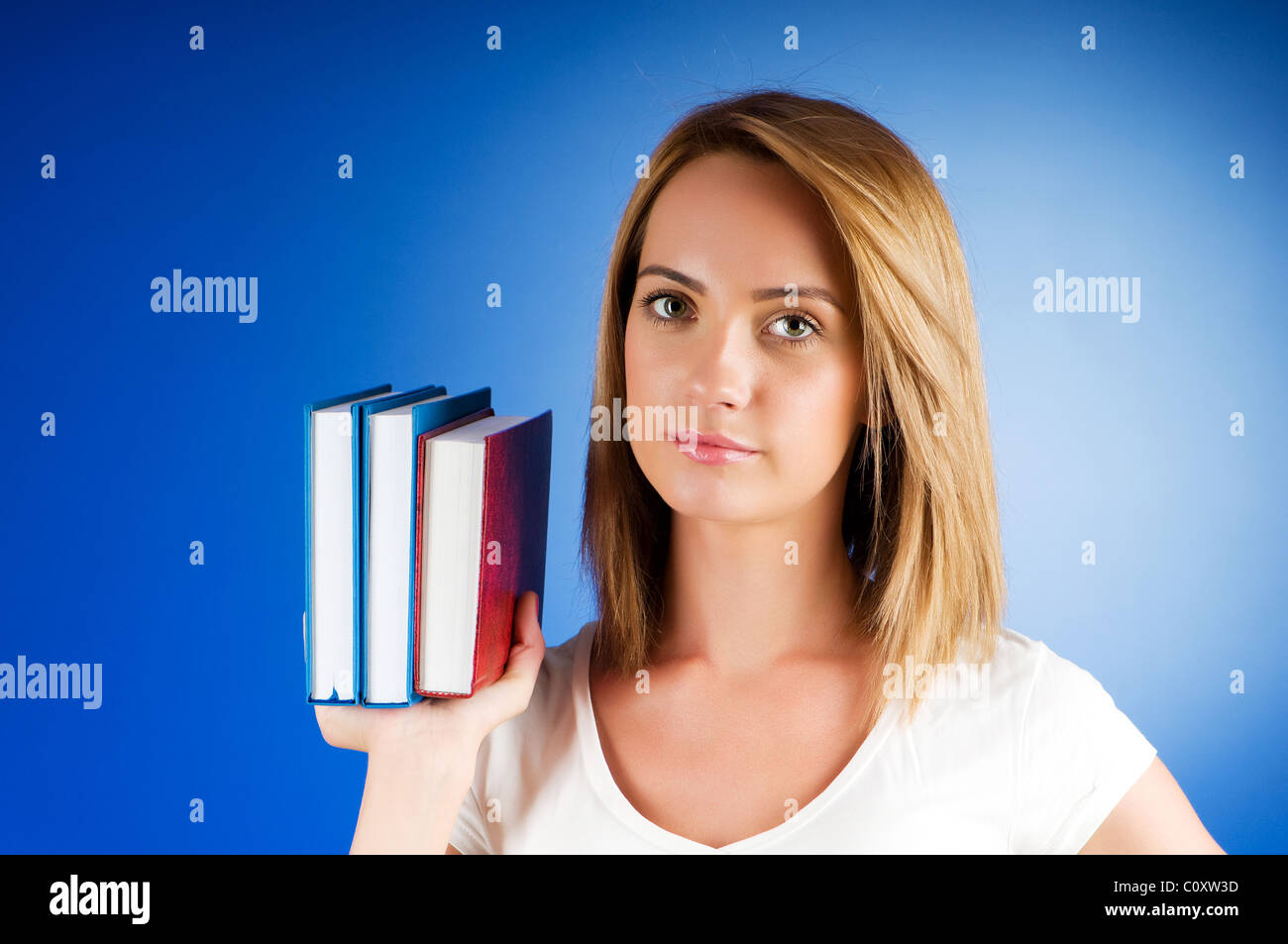 Young university student with many study textbooks Stock Photo - Alamy