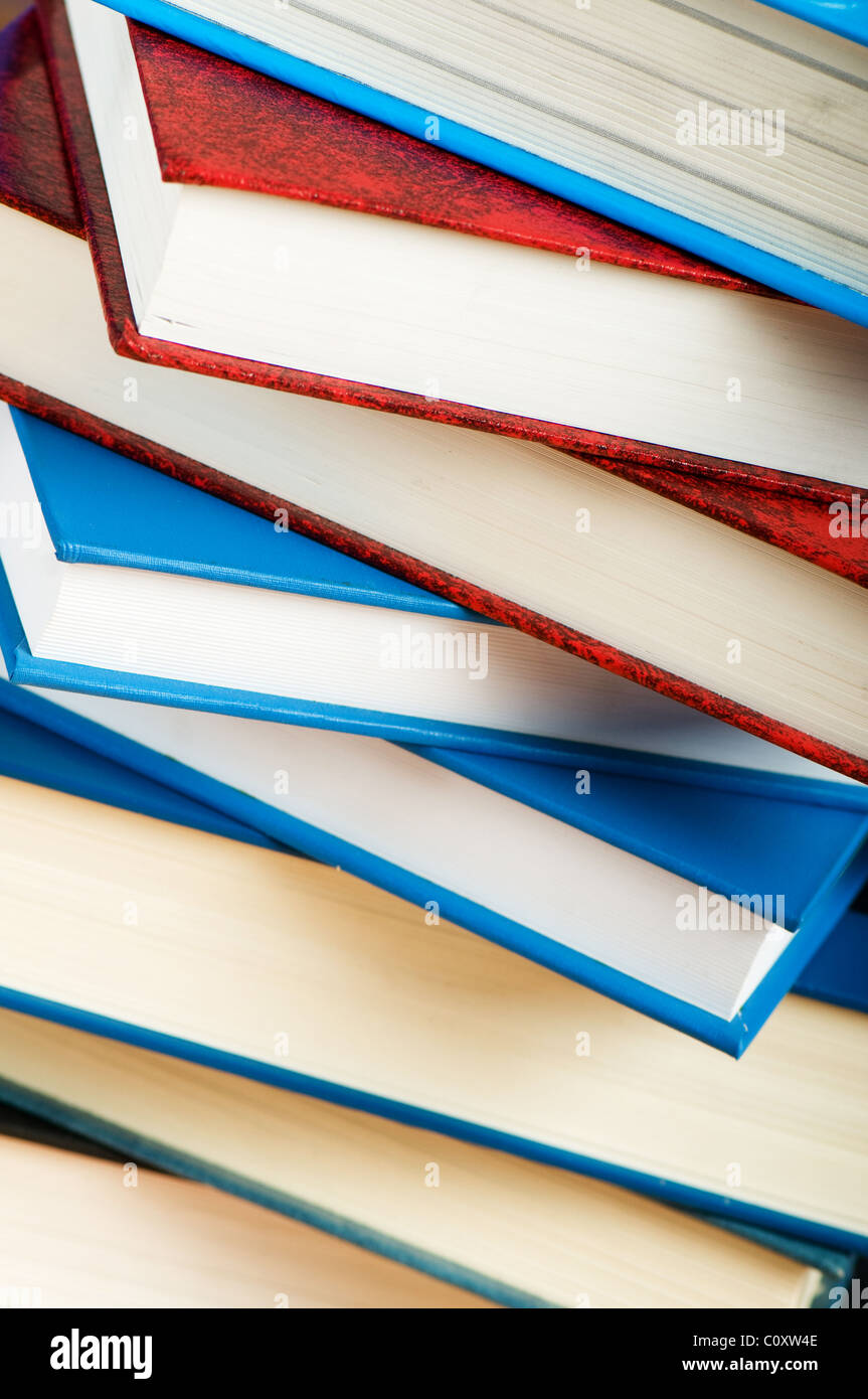 Stack of text books against gradient background Stock Photo - Alamy