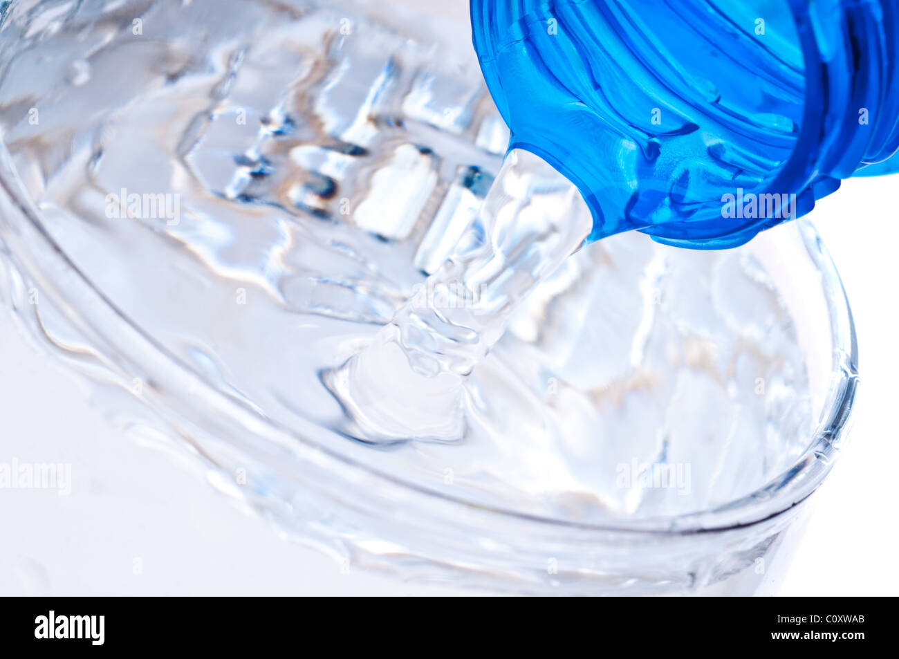 bottle pouring water into glass Stock Photo - Alamy