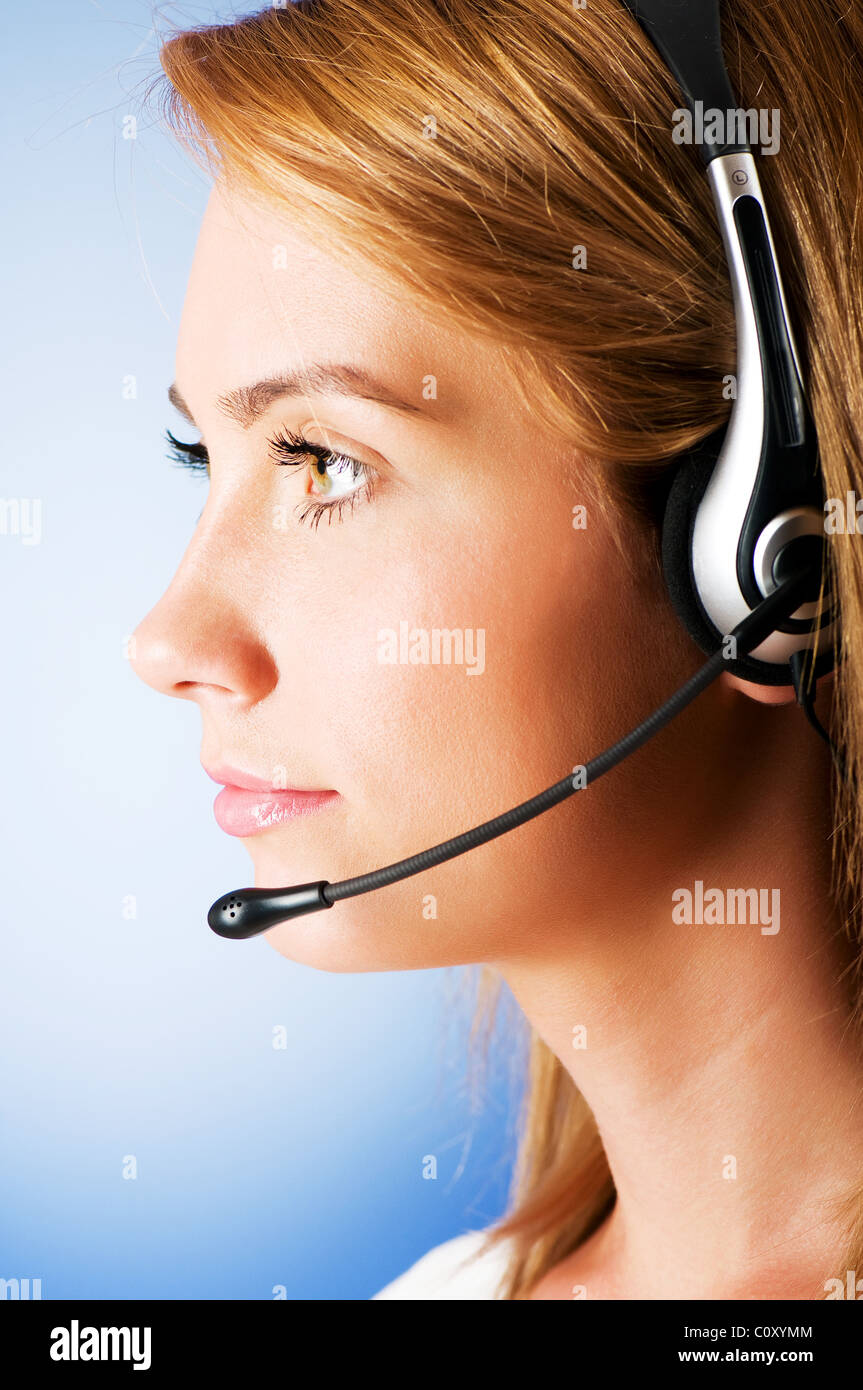 Young call center operator with the headset Stock Photo - Alamy