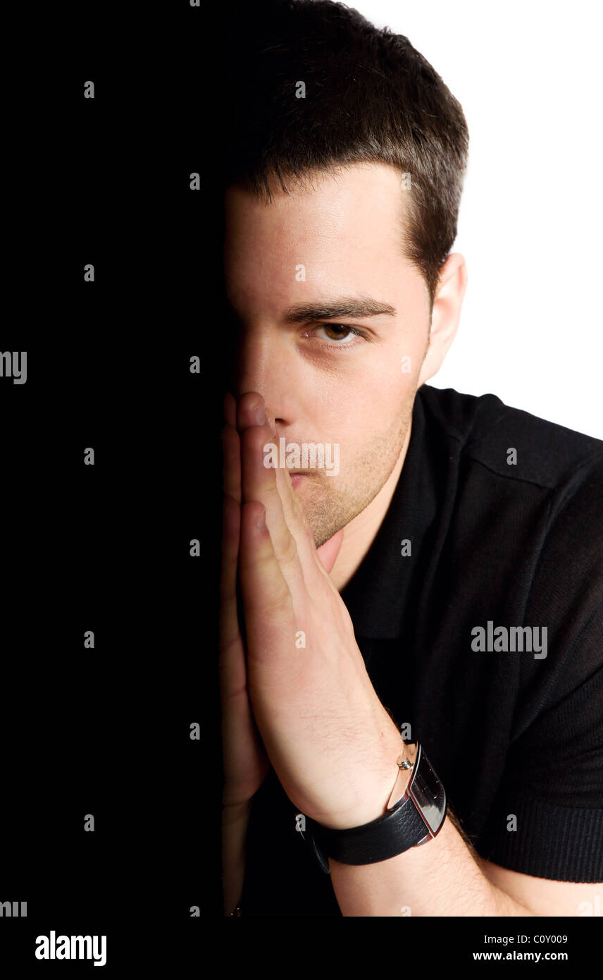 Pensive man face half light hi-res stock photography and images - Alamy