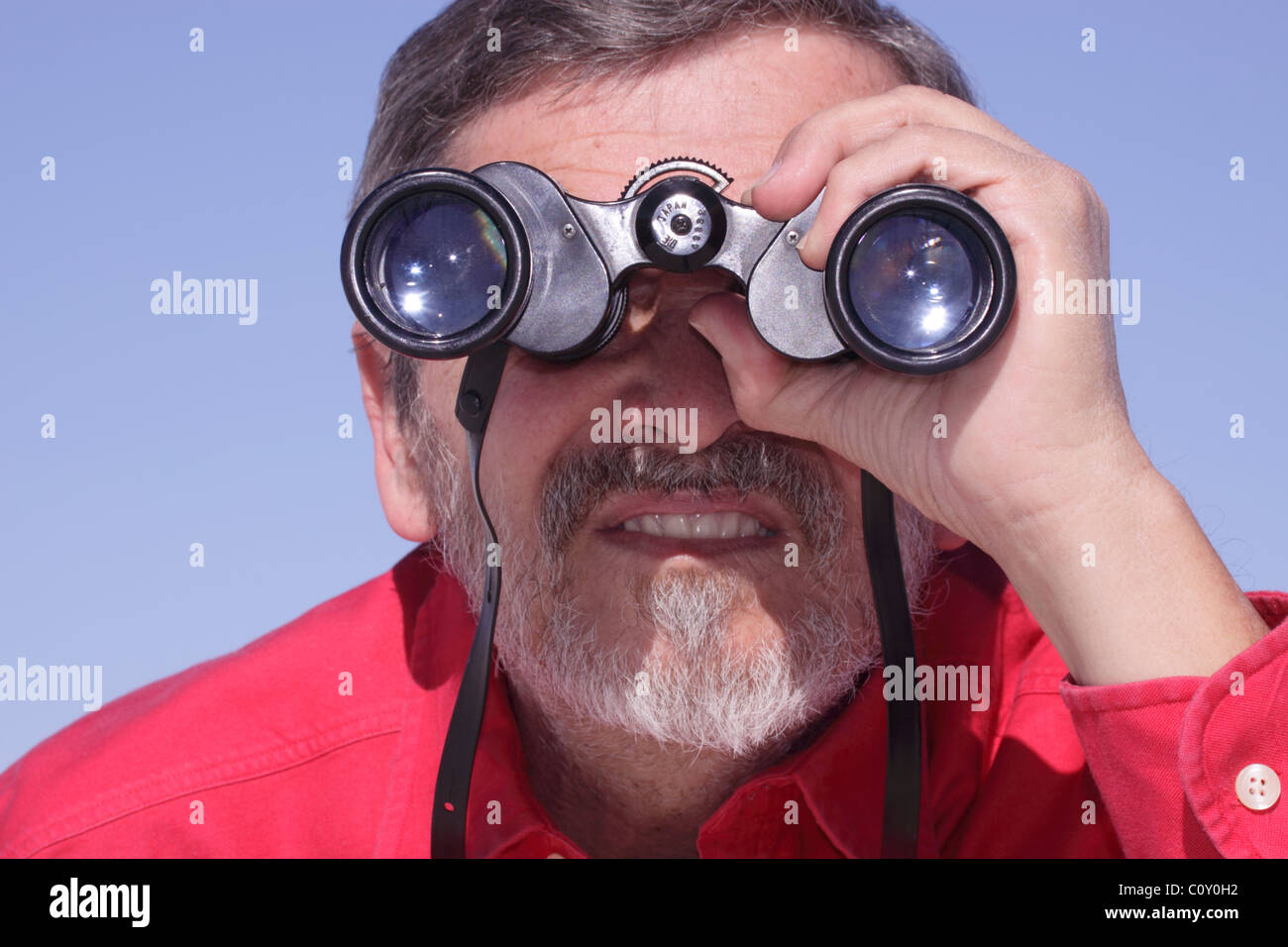 Man searching with Binoculars Stock Photo - Alamy
