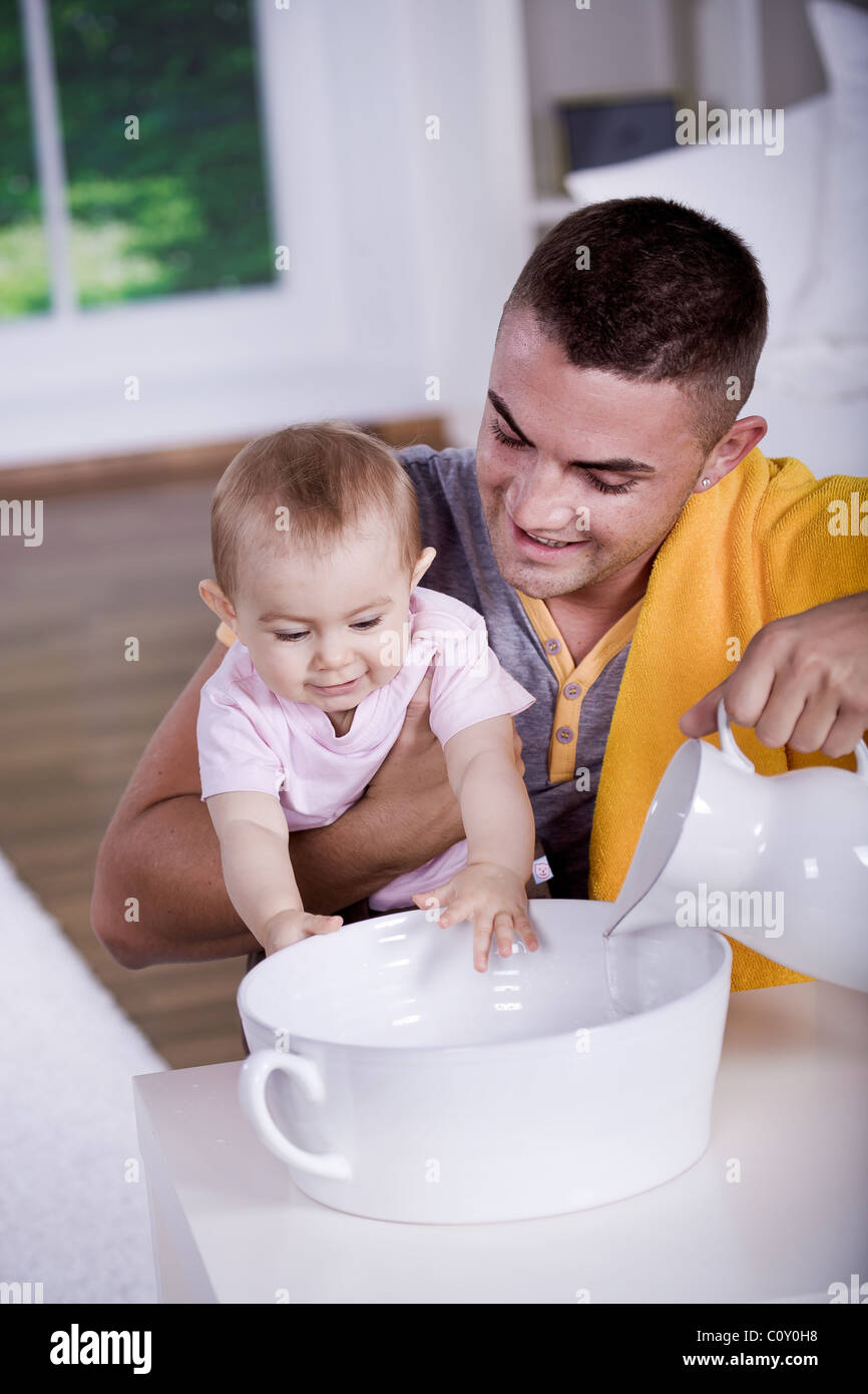 Father Bathing His Baby High Resolution Stock Photography and Images ...