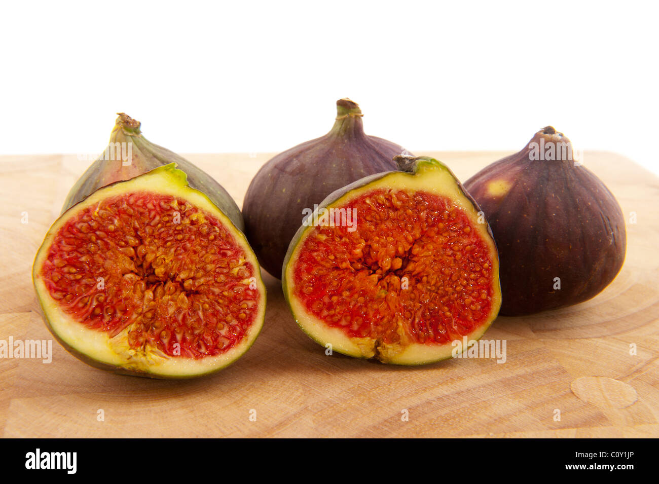 Figs fruit on a natural wooden timber Stock Photo - Alamy