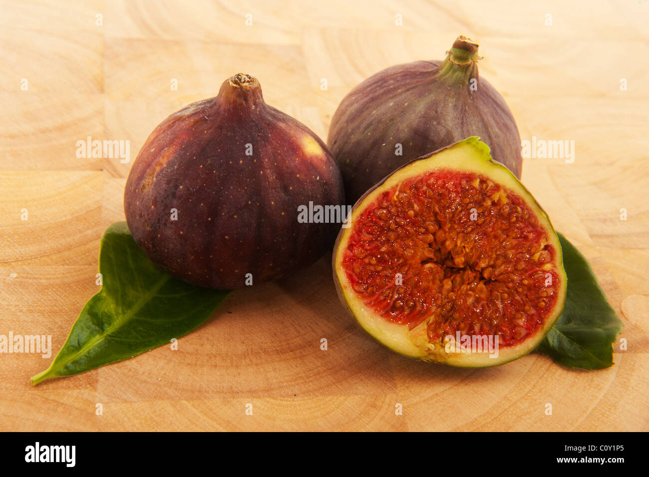 Figs fruit on a natural wooden timber Stock Photo - Alamy