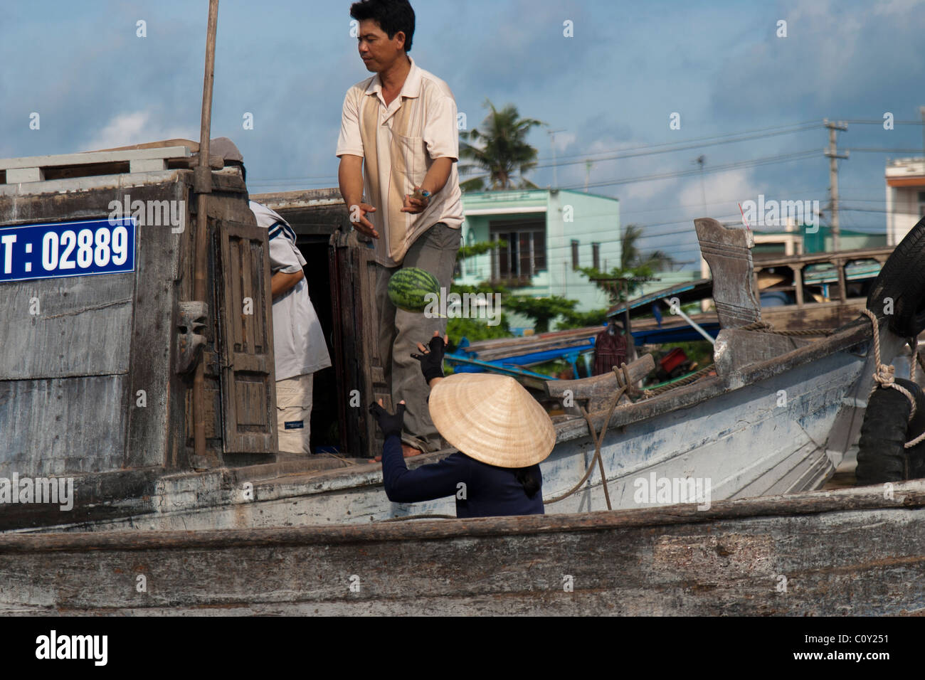 Cai Rang floating market, Mekong Delta, Vietnam. throwing melons from a ...