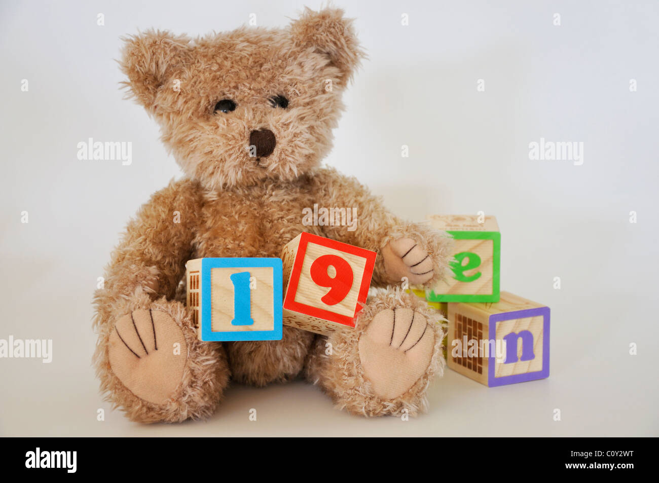 Teddy bear with cubes Stock Photo - Alamy